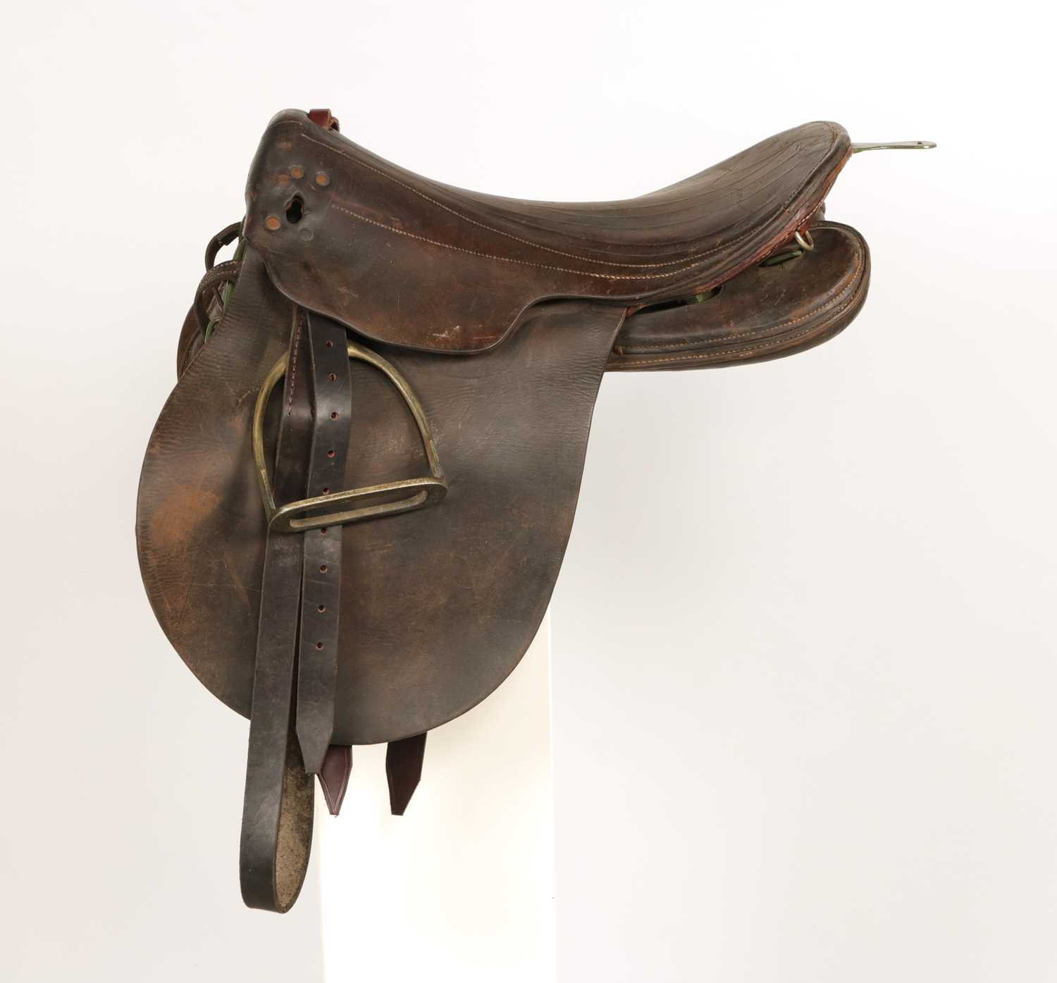 Lot 580 - Dutch cavelry leather saddle, with stirrups